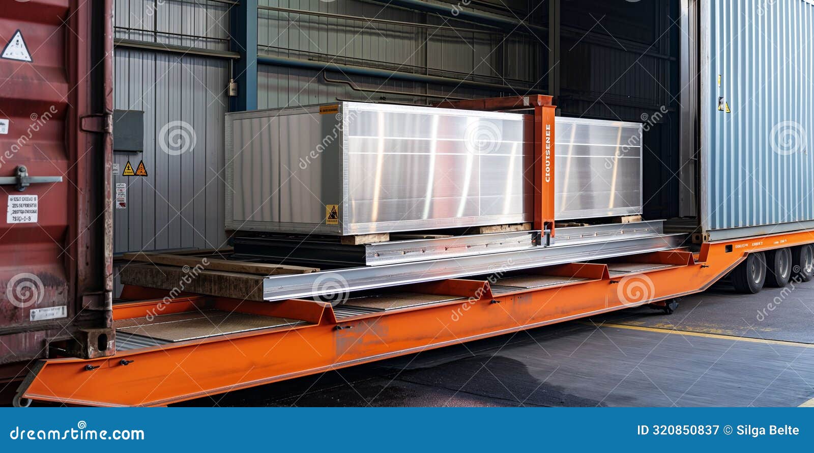 Metallic Container are Secured on an Orange Flatbed Truck at a Loading ...