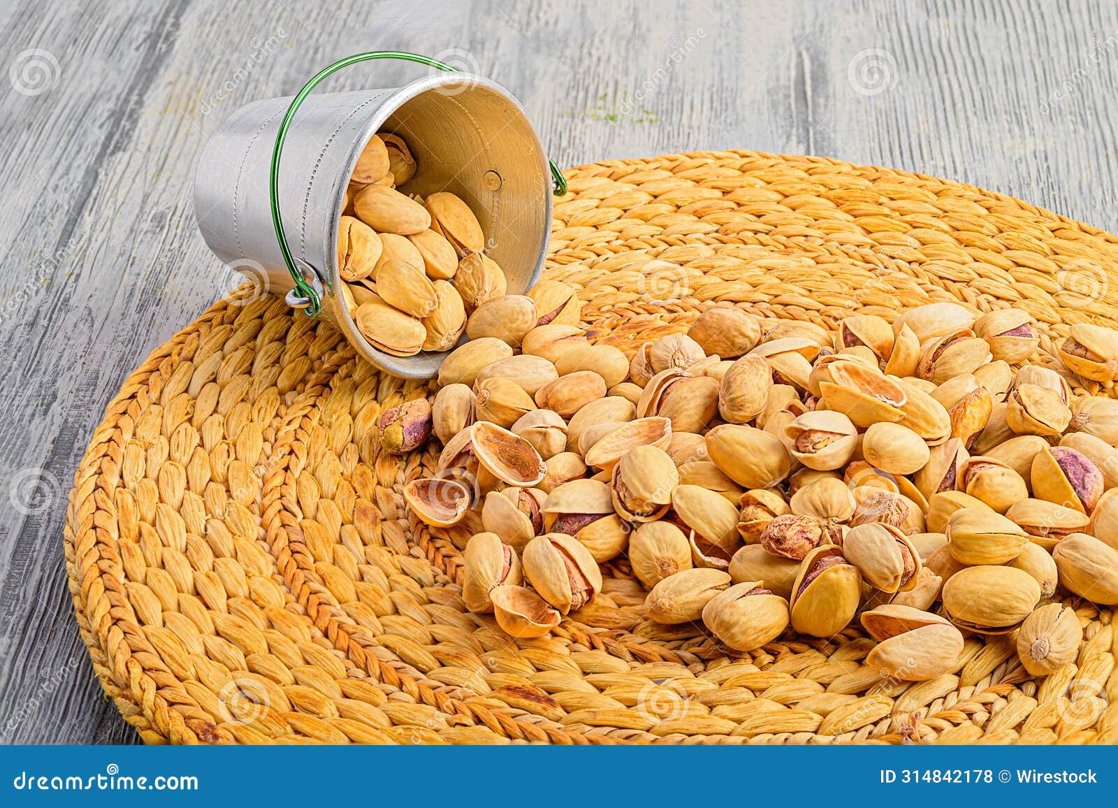 Metallic Cube Full of Pistachios on Rustic Esparto Stock Photo - Image ...