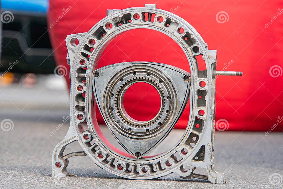 A Metallic Engine or Transmission Component is Centered in the Frame ...