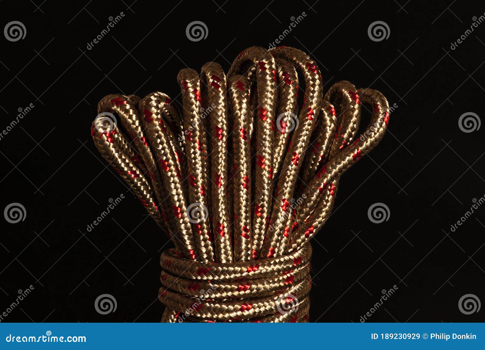Metallic gold and red rope stock image. Image of rope - 189230929
