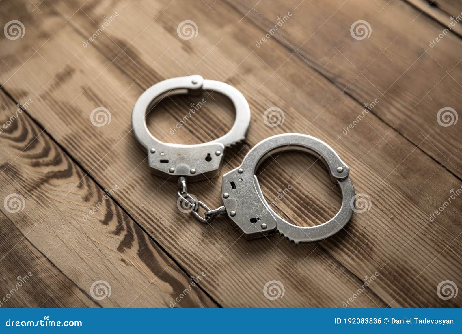 Metallic Handcuffs on Table Stock Photo - Image of open, punishment ...