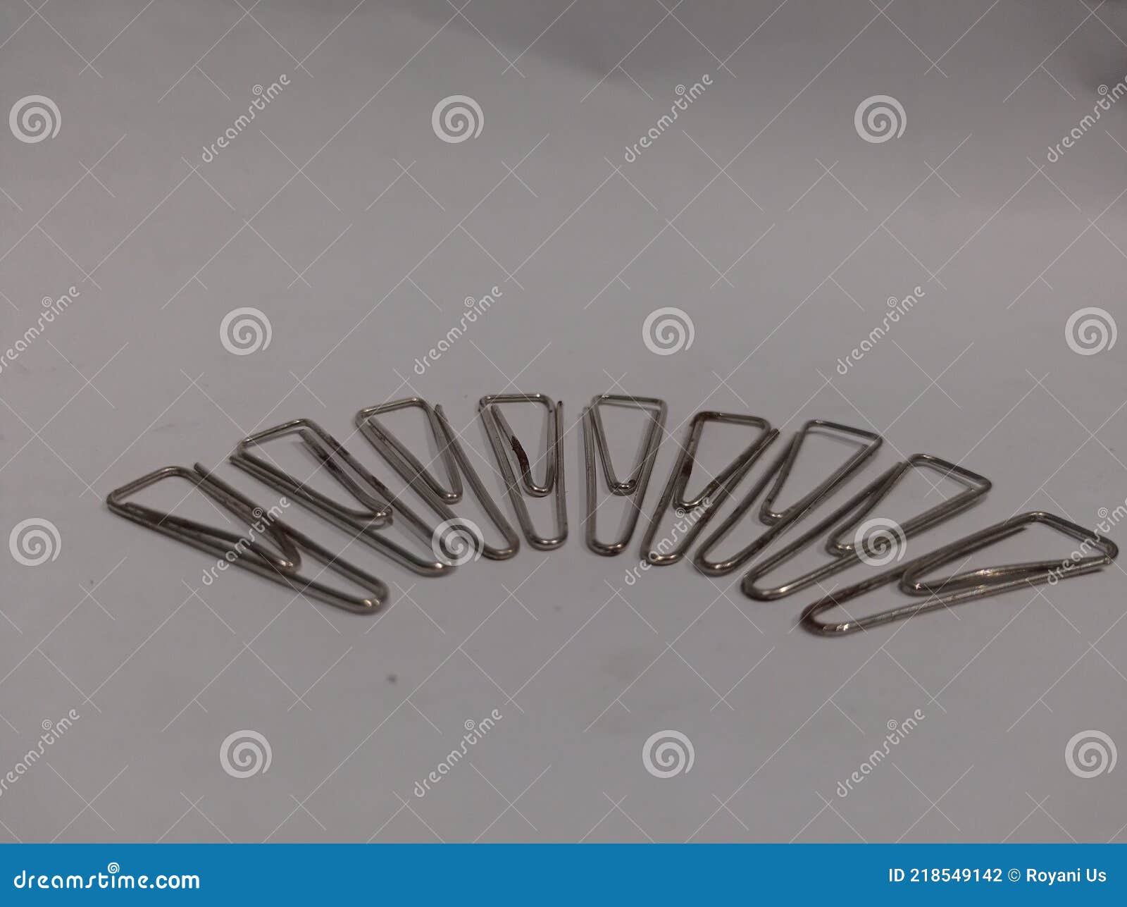 Metallic Paper Clip, Isolated on White Stock Photo - Image of ...