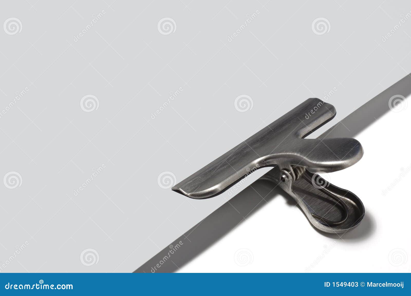 Metallic Paperclip on Grey Paper Stock Image - Image of attach, clean ...