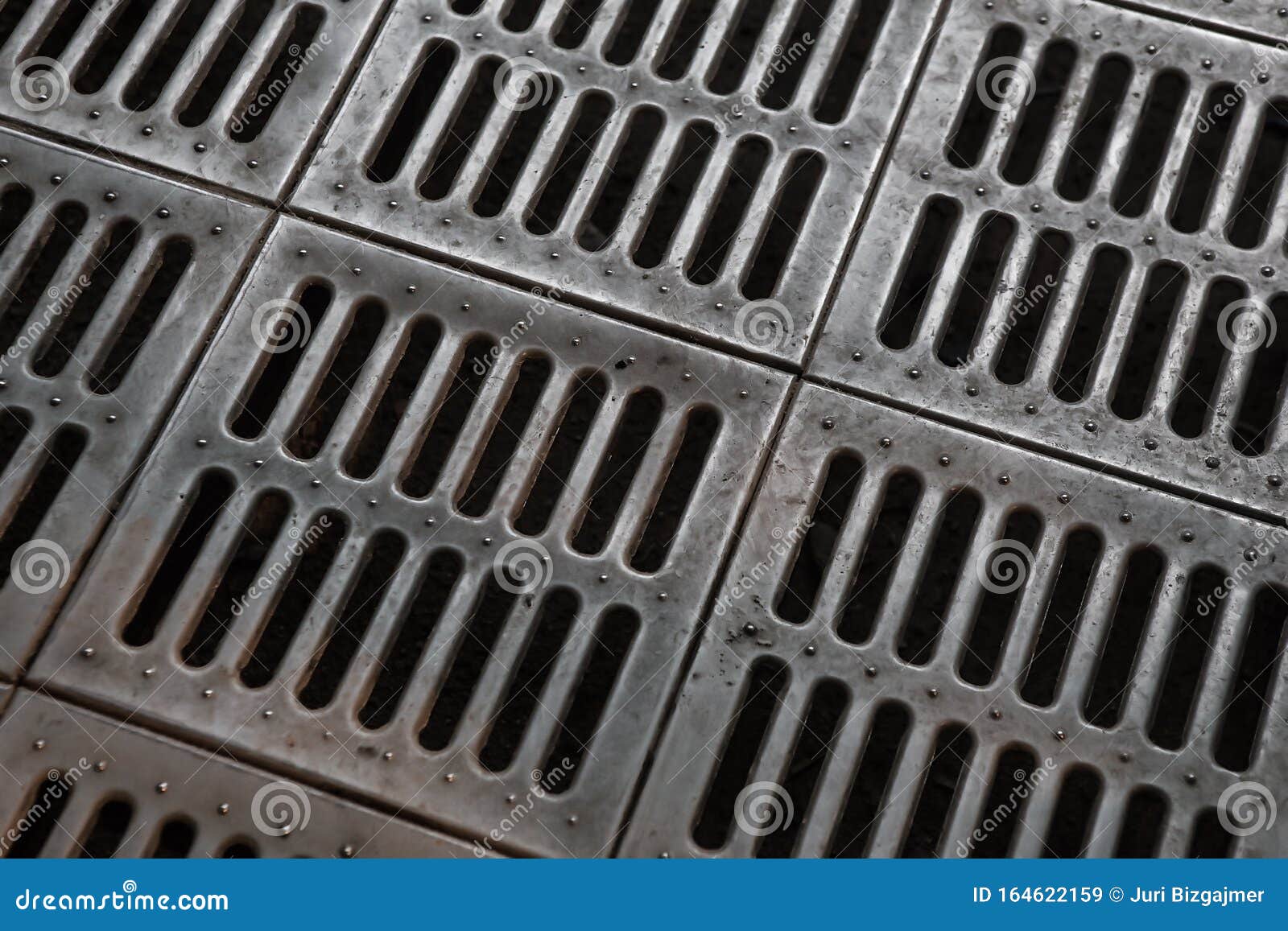 Metallic pavement grate stock image. Image of grid, industrial - 164622159