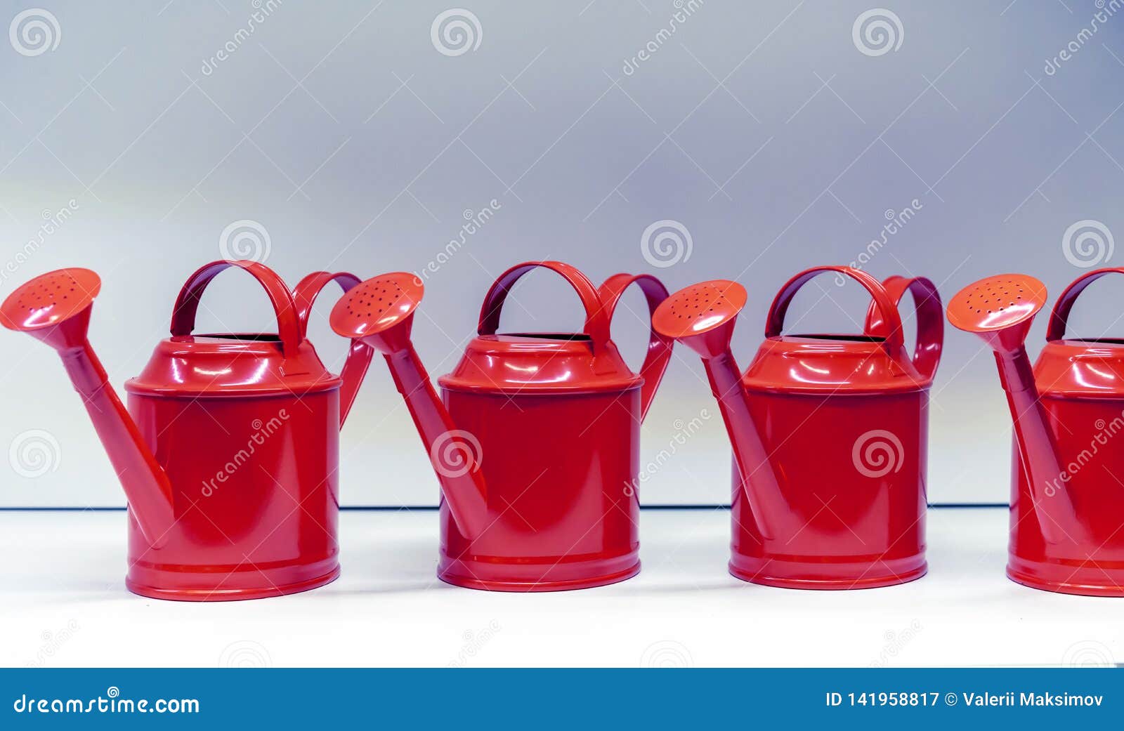 Metallic Red Watering Cans for Watering Flowers and Plants Stock Image ...
