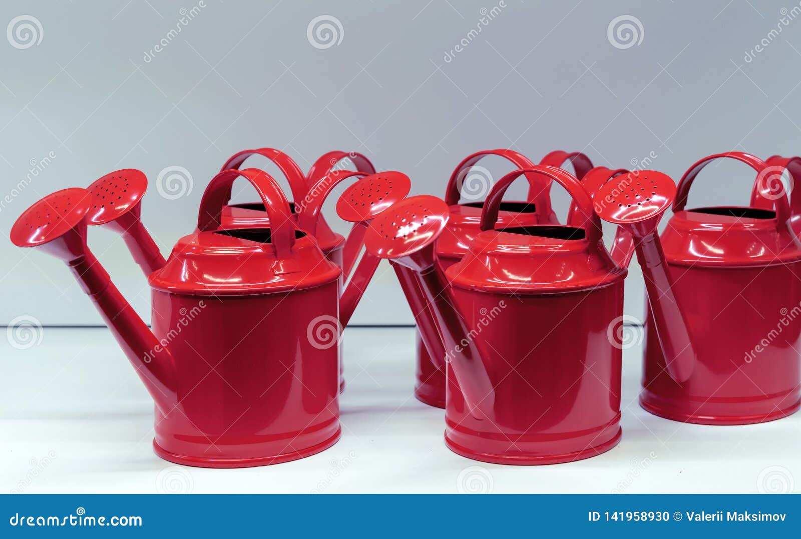 Metallic Red Watering Cans for Watering Flowers and Plants Stock Photo ...