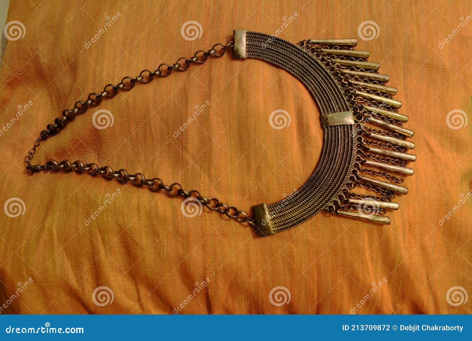 Metallic Rustic Designed Neck less on a Yellow Background Stock Photo ...