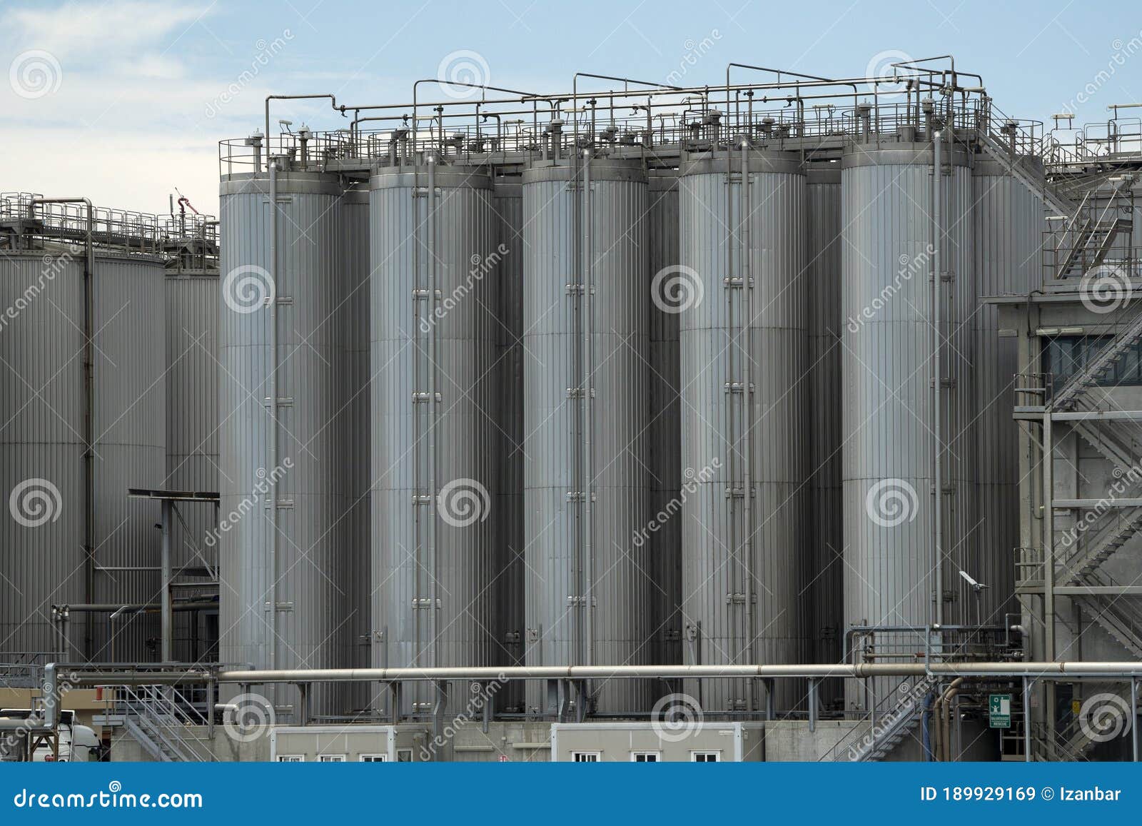 Metallic Silos on Light Blue Sky Stock Image - Image of food, cereal ...