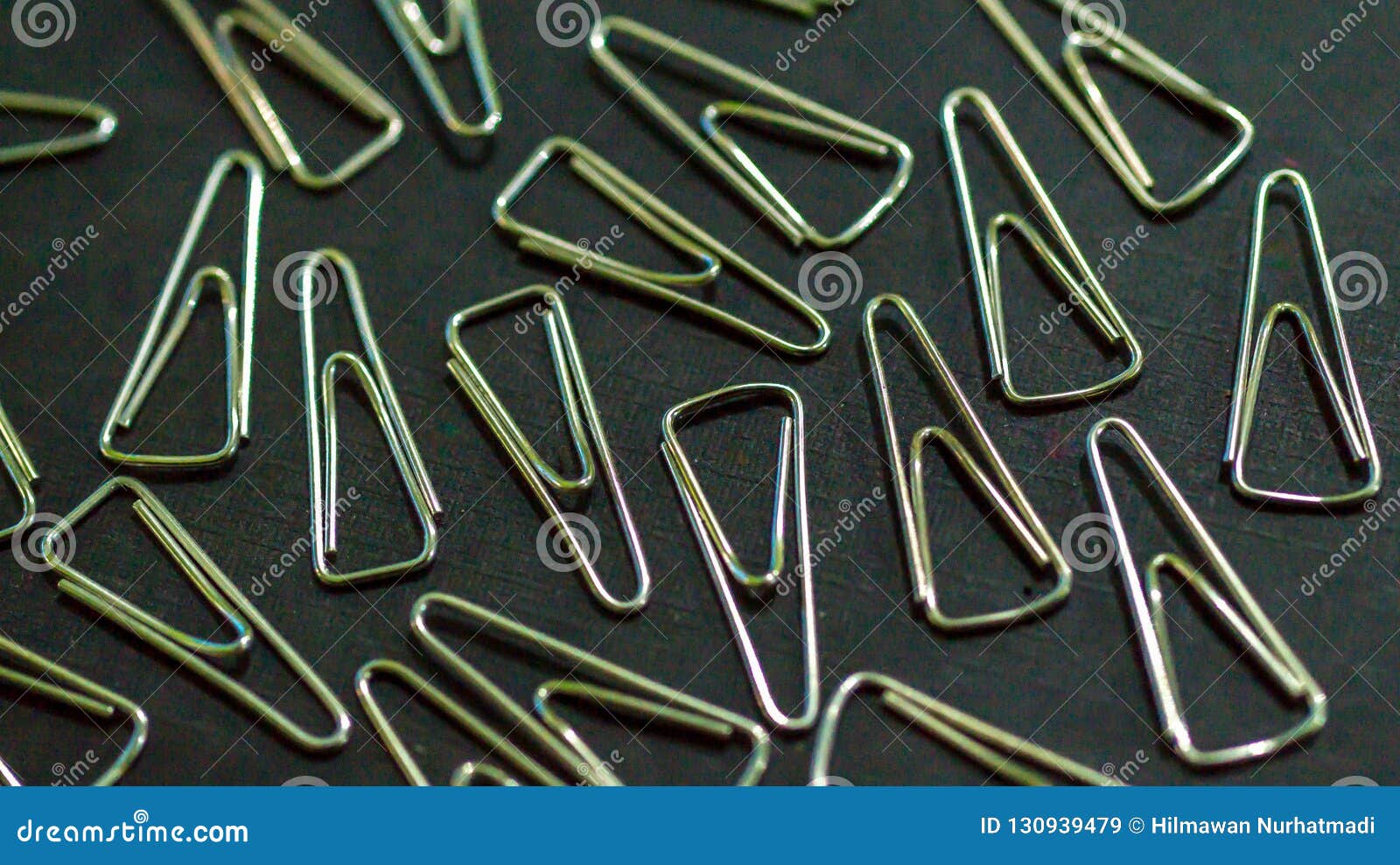 Metallic Triangular Paper Clip. Stock Image - Image of school, supply ...