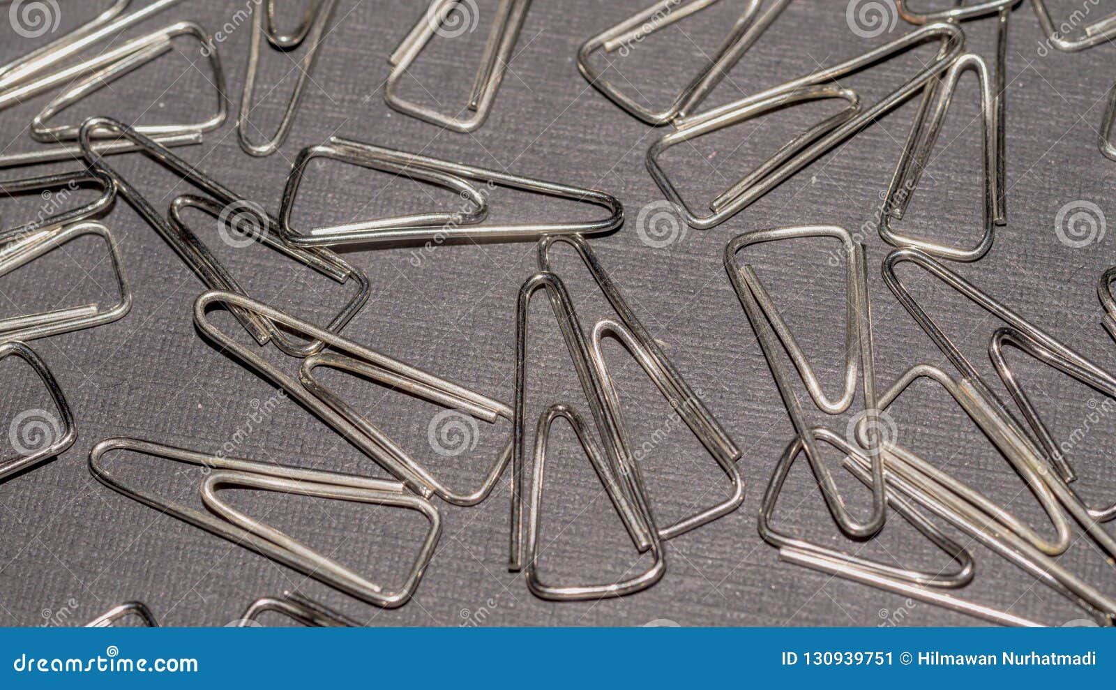Metallic Triangular Paper Clip. Stock Image - Image of binder, silver ...