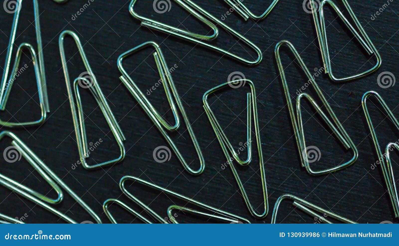 Metallic Triangular Paper Clip. Stock Photo - Image of office, supply ...