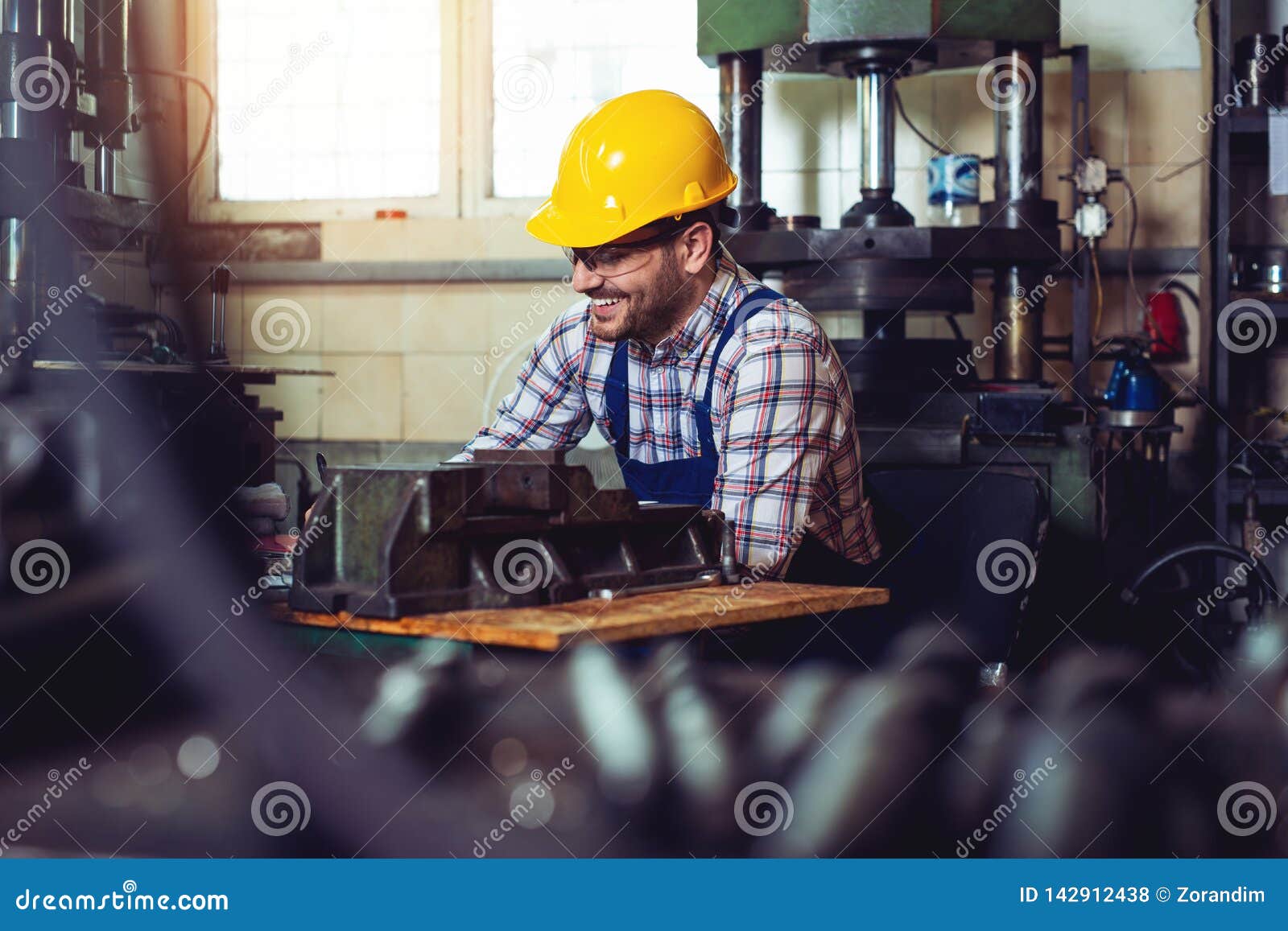 Metallurgy Worker Happily Working in His Workshop with Safety Helmet on ...