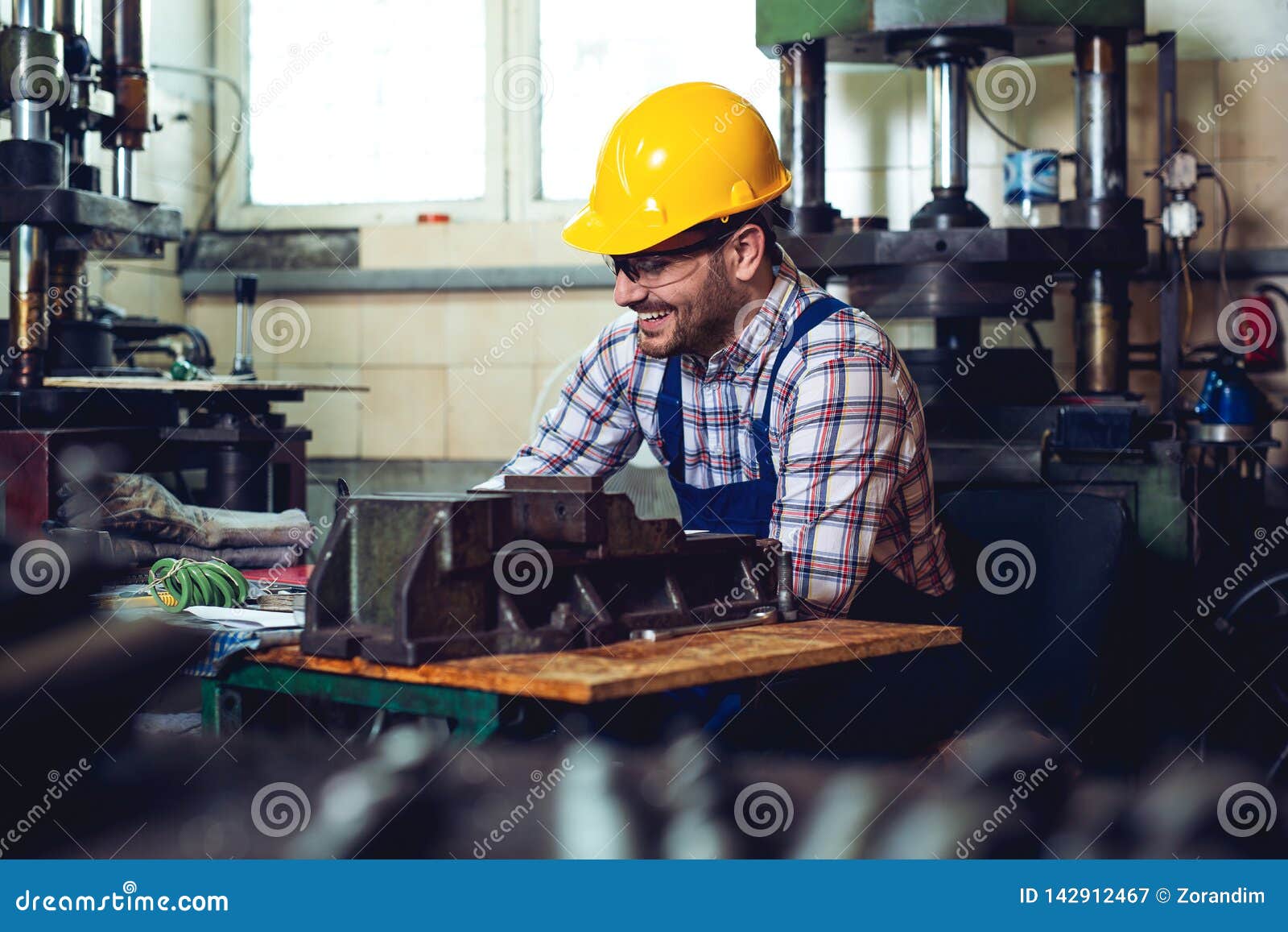 Metallurgy Worker Happily Working in His Workshop with Safety Helmet on ...