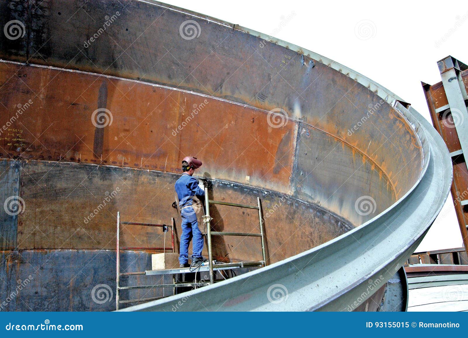 Metalwork Construction of Large Tubes with Workers Working Welding ...