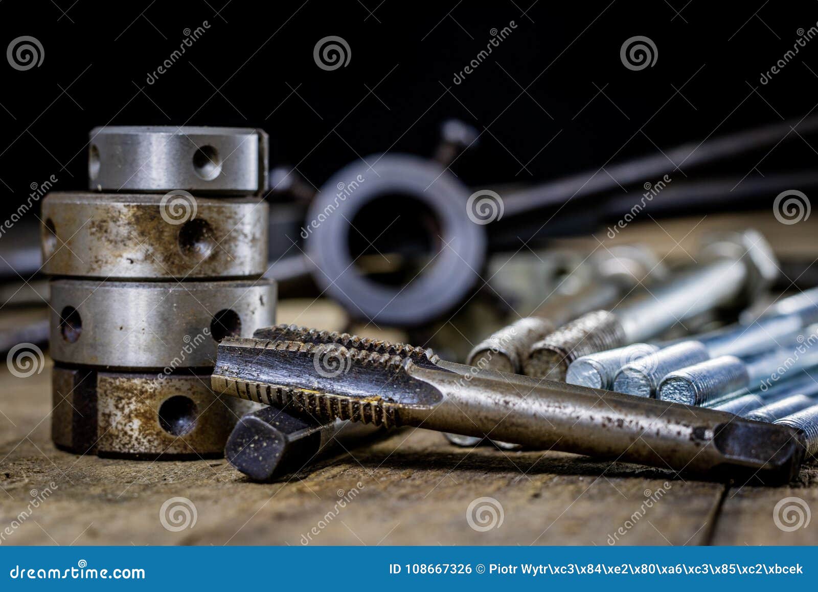 Metalwork Tools on the Workshop Table. Threading Dies and Taps I Stock ...