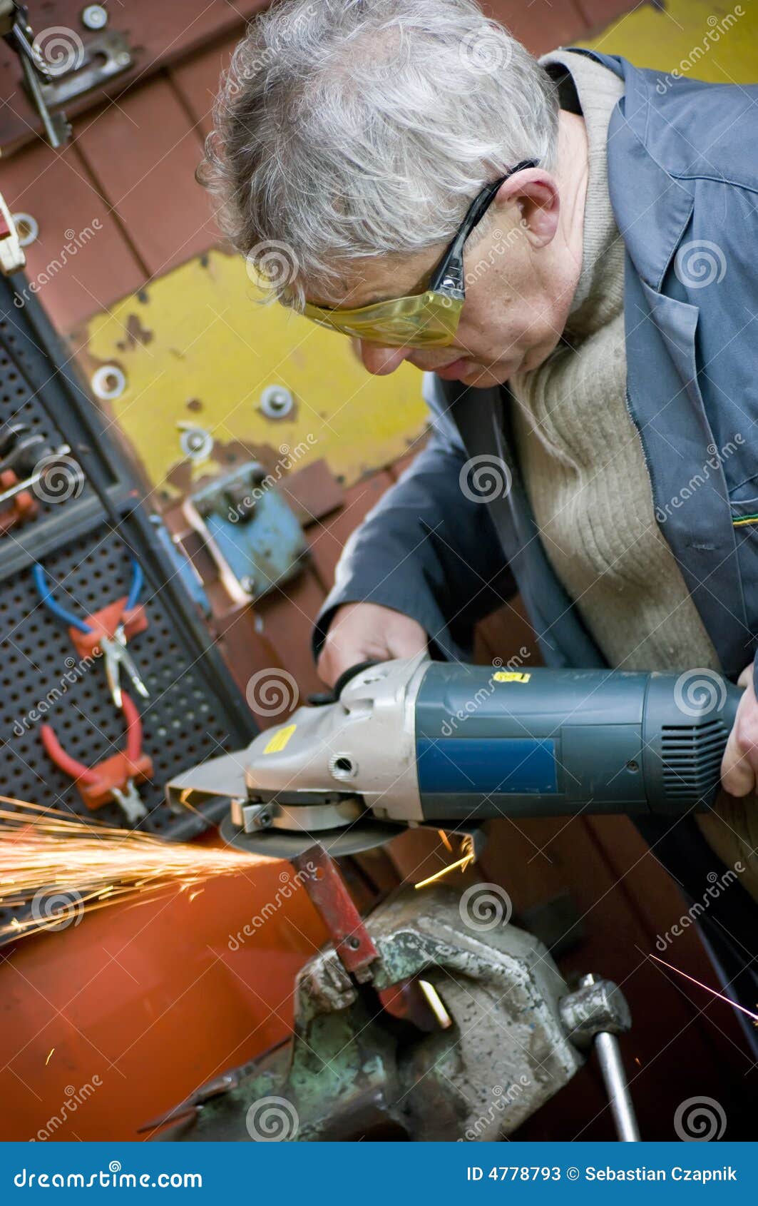Metalworker cutting metal stock image. Image of protective - 4778793