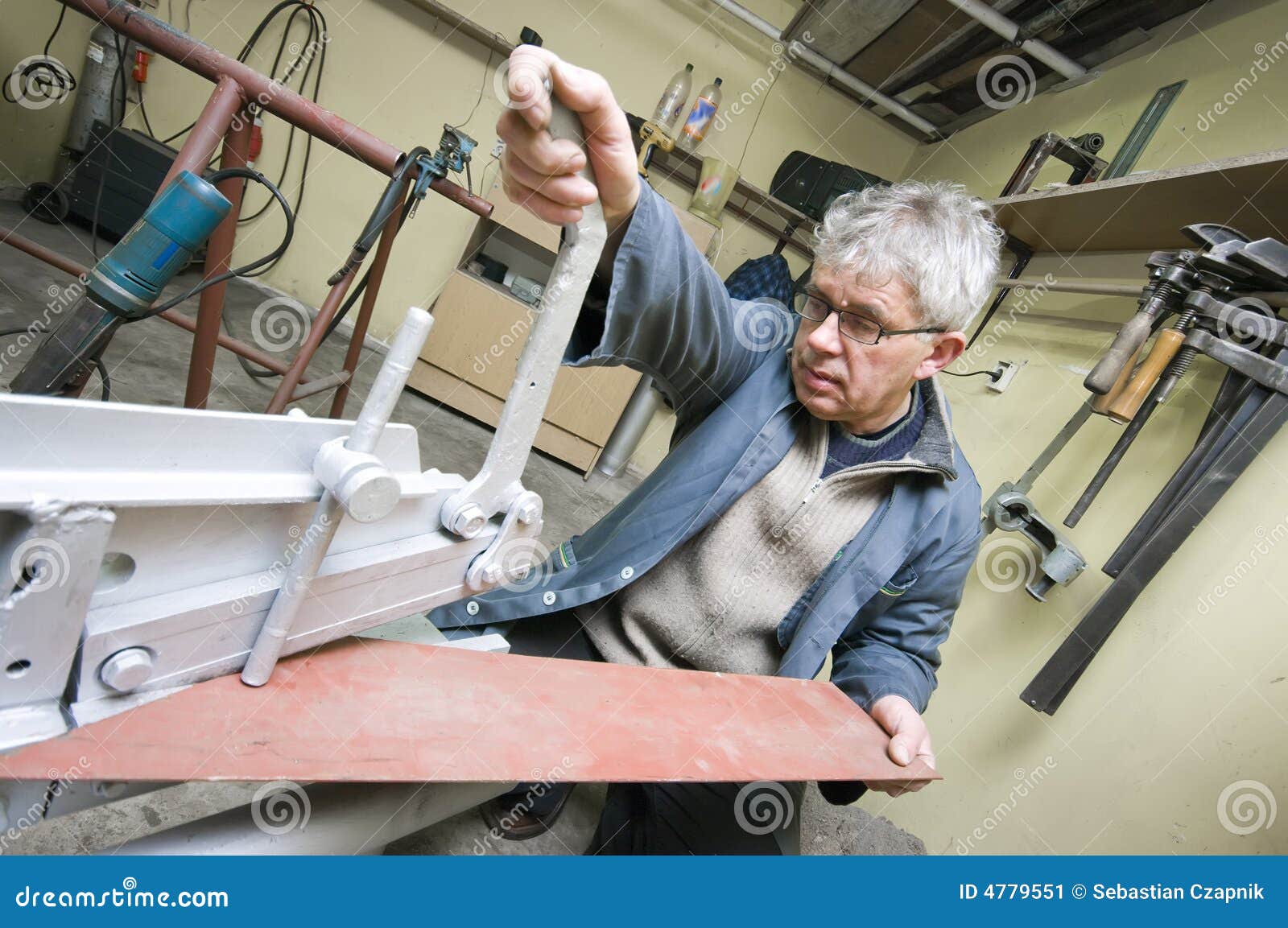 Metalworker and guillotine stock image. Image of caucasian - 4779551