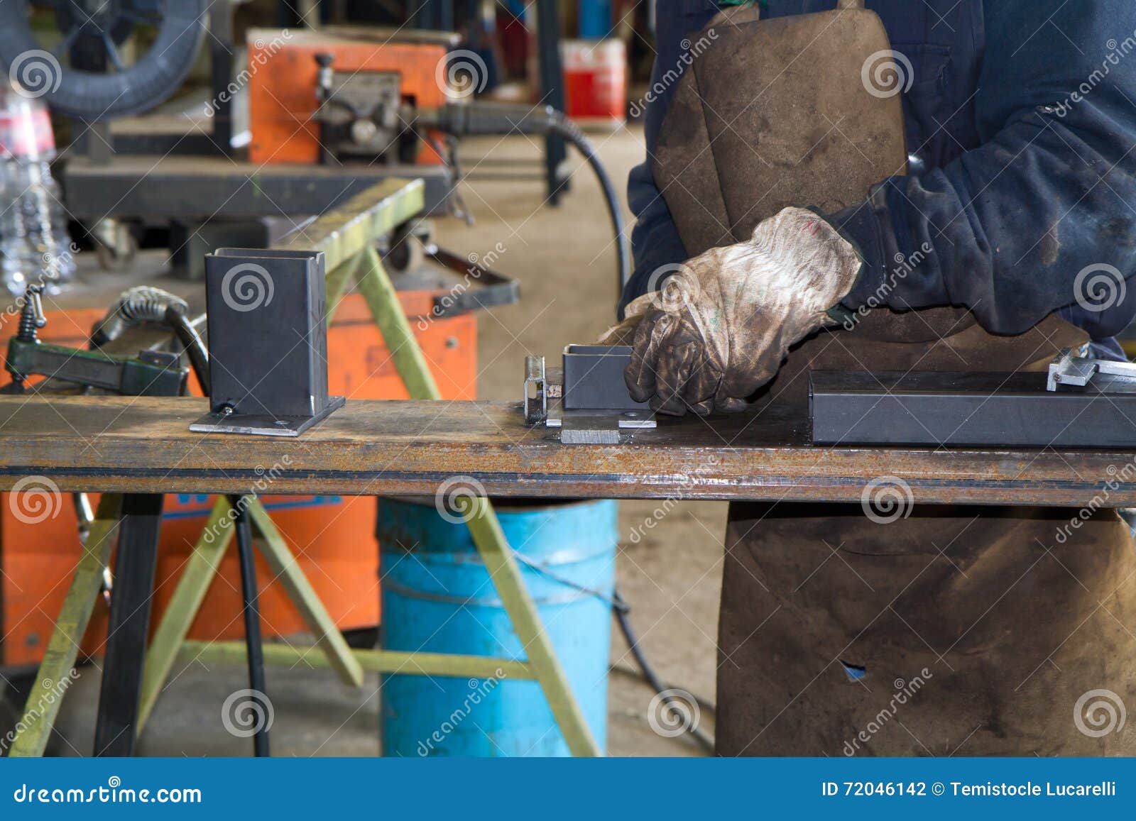 Metalworker At Work Welding Steel With Spread Spark And Lighting Around ...