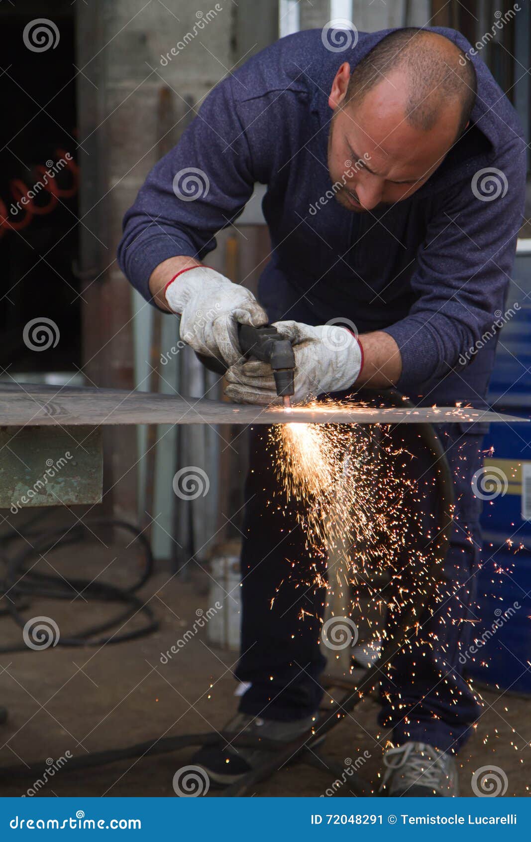 Metalworker at work stock image. Image of factory, industrial - 72048291