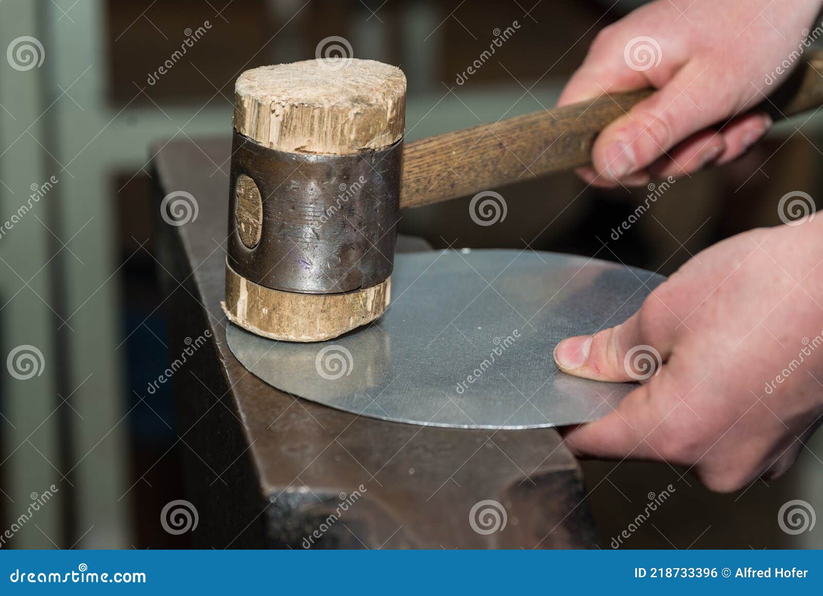 Metalworking with a mallet stock photo. Image of metalworking - 218733396
