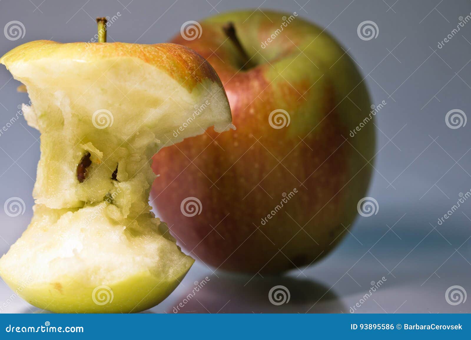 Metaphore of Bitten Apple with Sad Face Expression beside Happy Whole ...