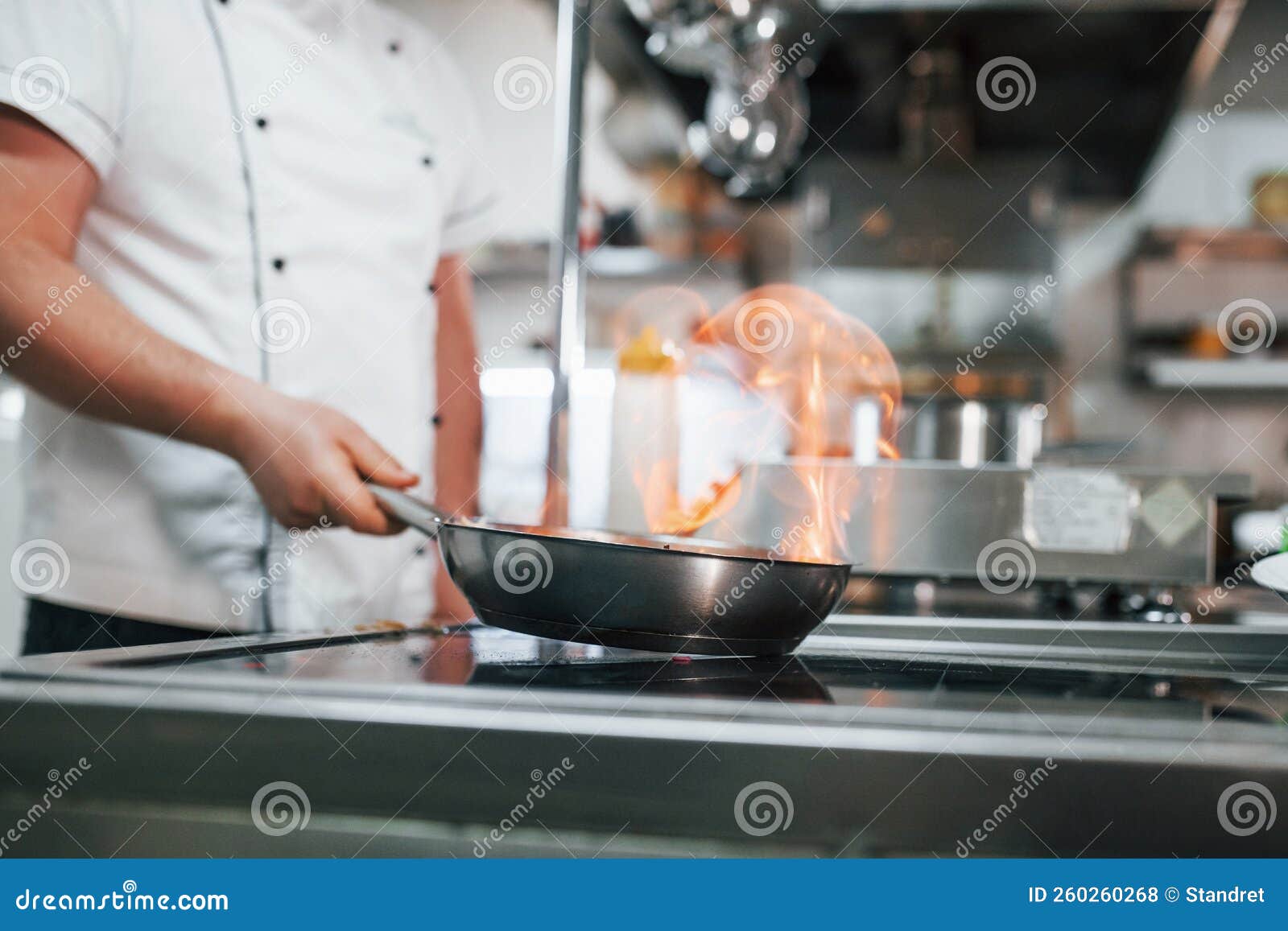 Method of Cooking by Igniting Meal. Professional Chef Preparing Food in ...