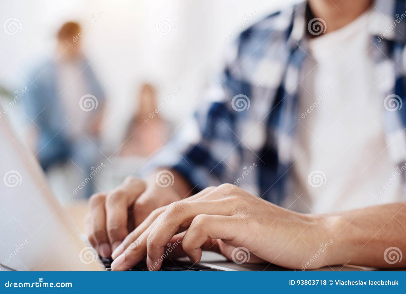 Methodical Productive Young Man Typing on His Laptop Stock Photo ...