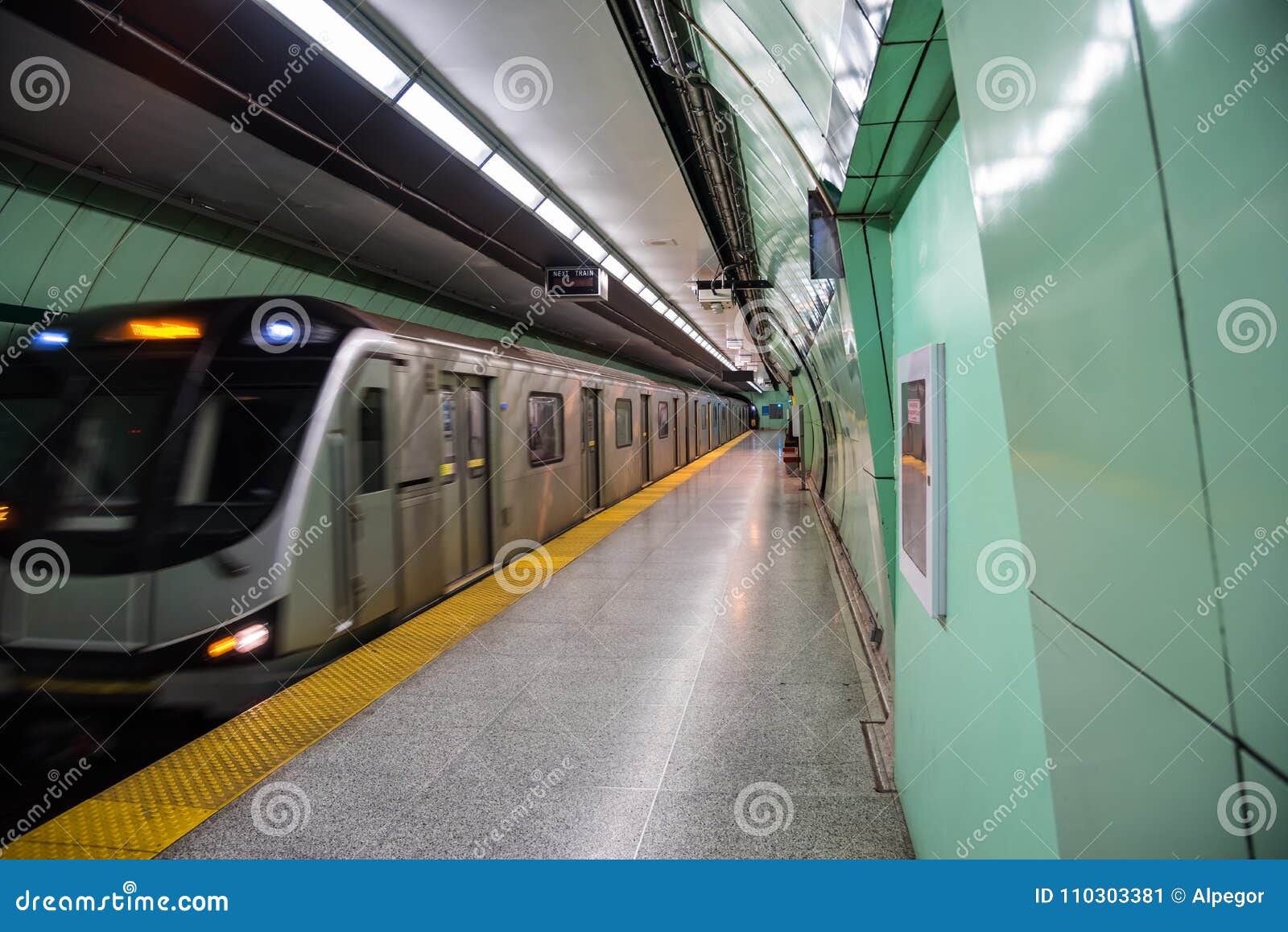 Metro Train Pulling into a Deserted Platform Stock Image - Image of ...