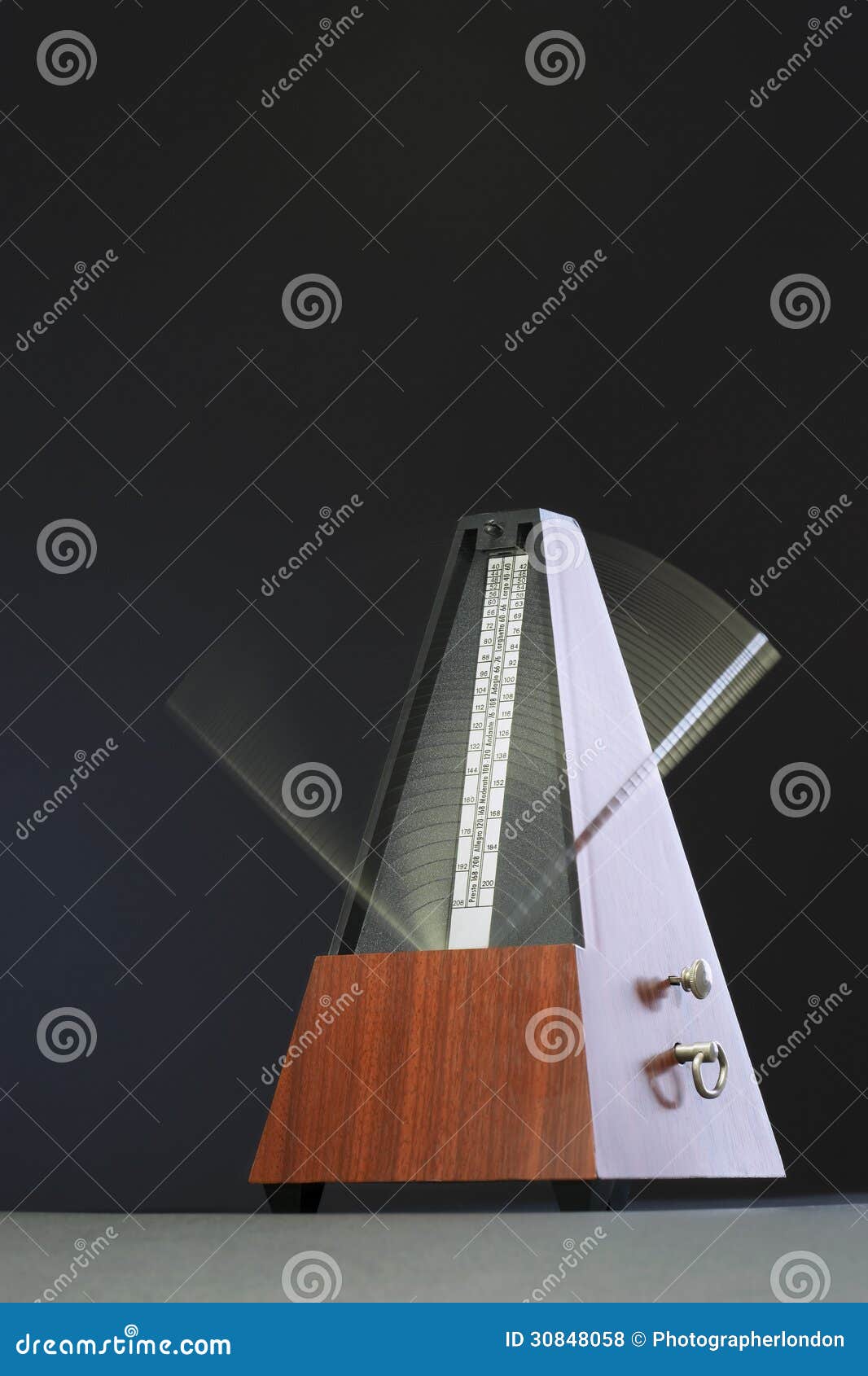 Metronome in motion stock photo. Image of object, close - 30848058