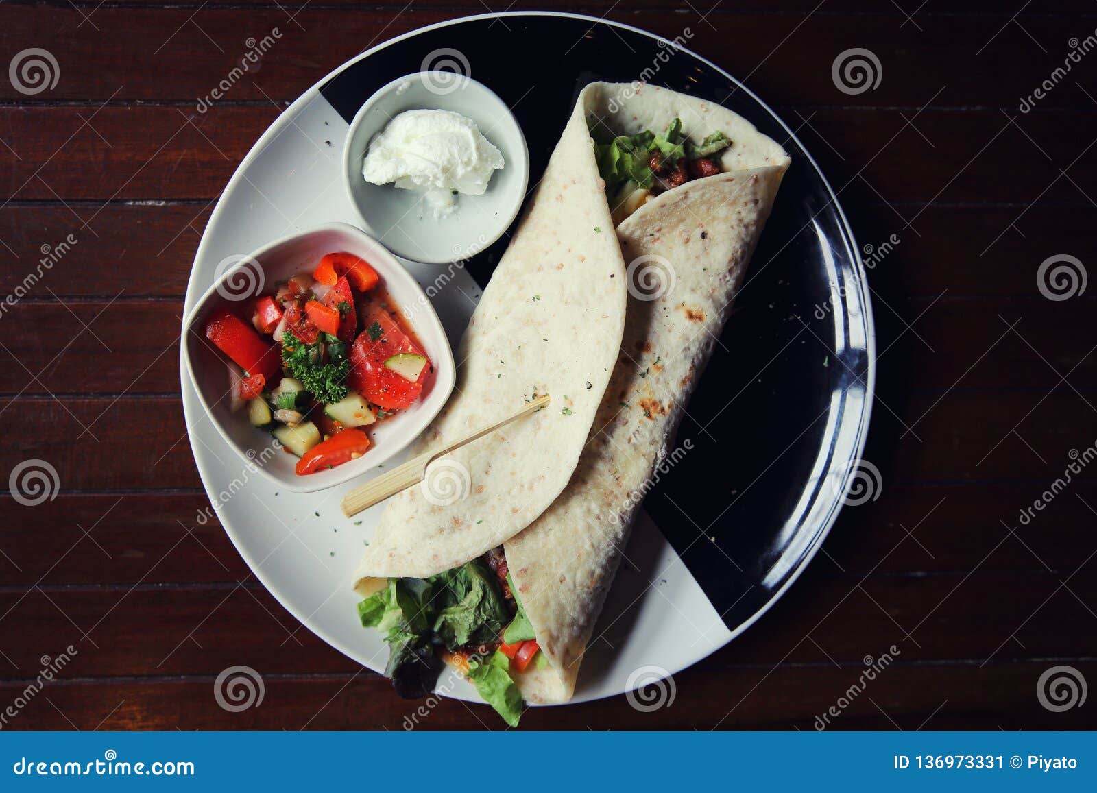 Mexican Burritos on a Plate with Tomato Salad Stock Image - Image of ...