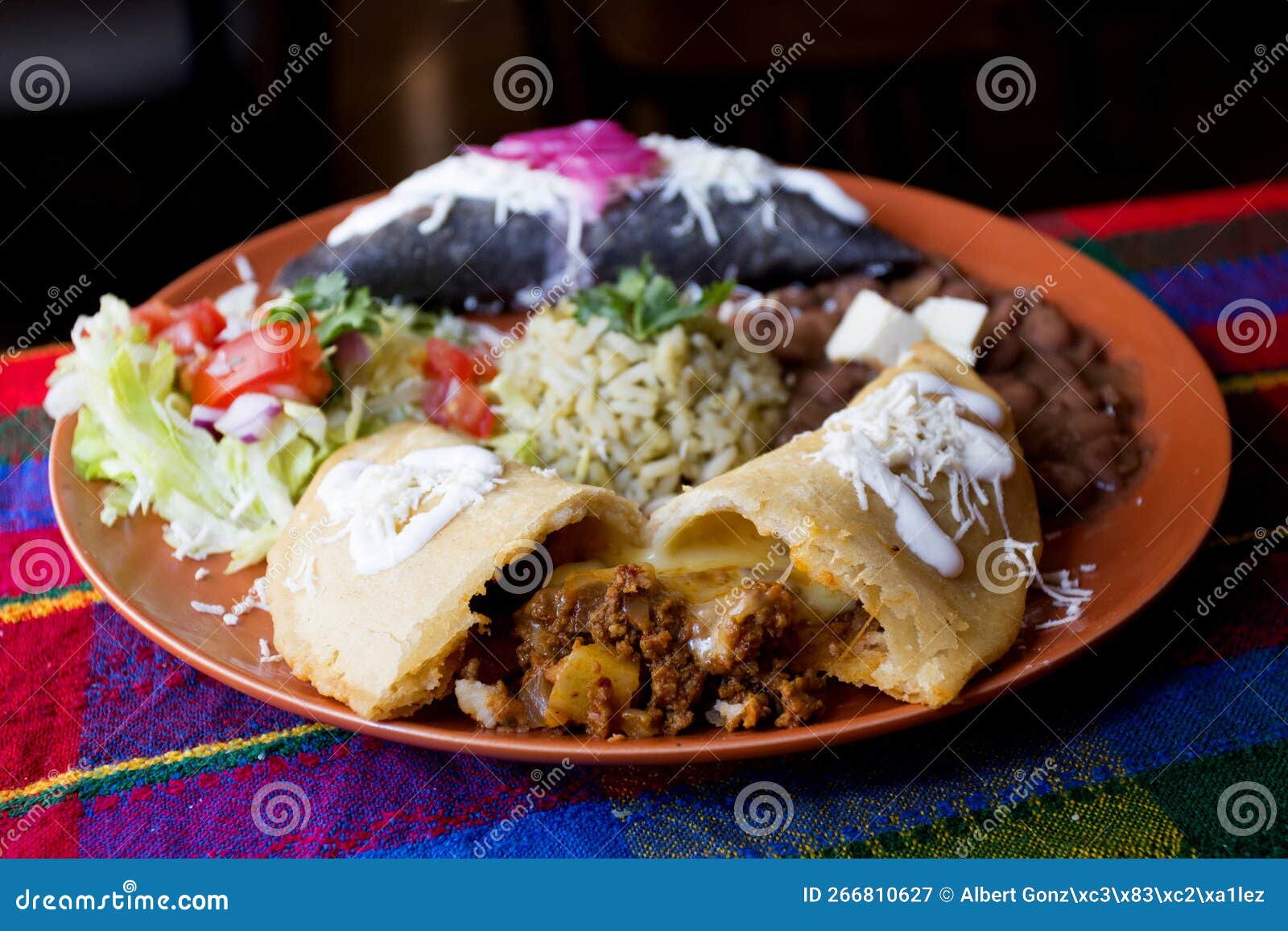Mexican Combo Plate with Stuffed Corn Empanadas Stock Image - Image of ...