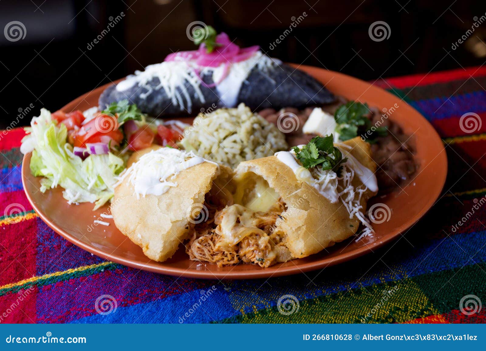 Mexican Combo Plate with Stuffed Corn Empanadas Stock Photo - Image of ...