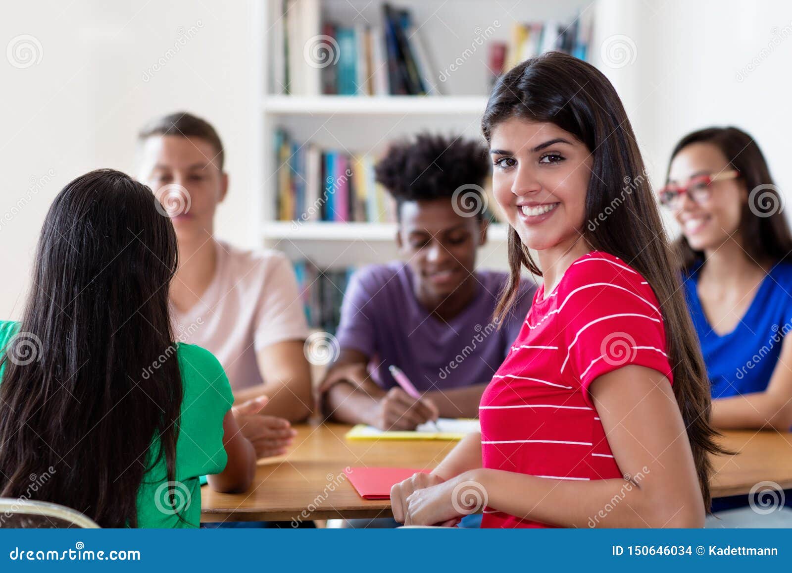 Mexican Female Student Learning with Group of Students Stock Photo ...