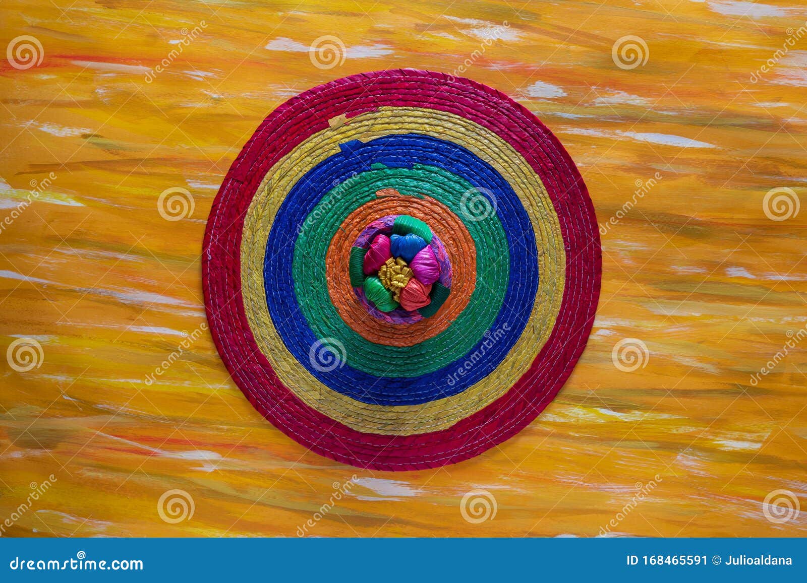 Mexican Hand-woven Round Tablecloth on Yellow Surface. Stock Image ...