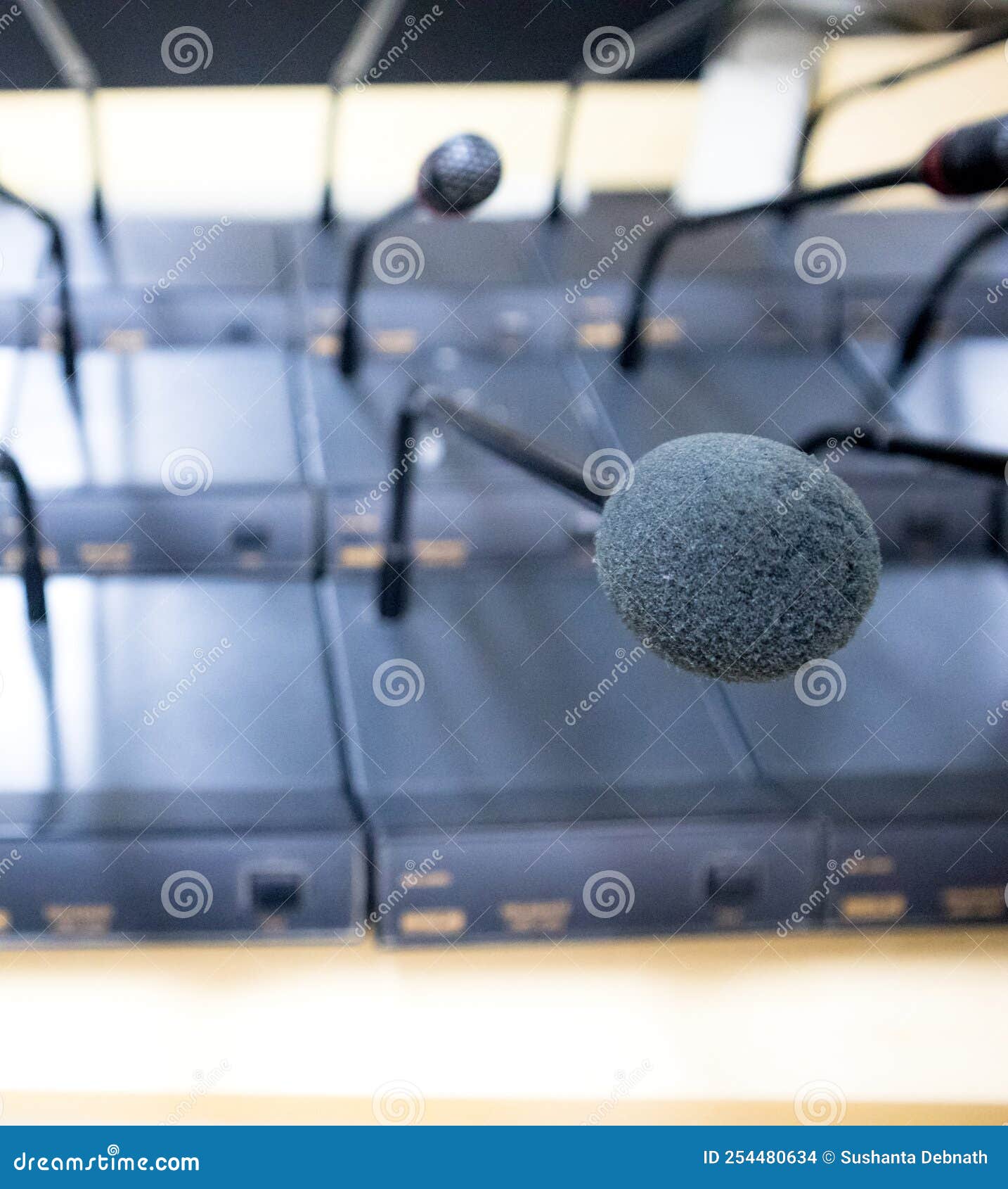 A Mic in Focus among Several Stock Photo - Image of electronic, concert ...