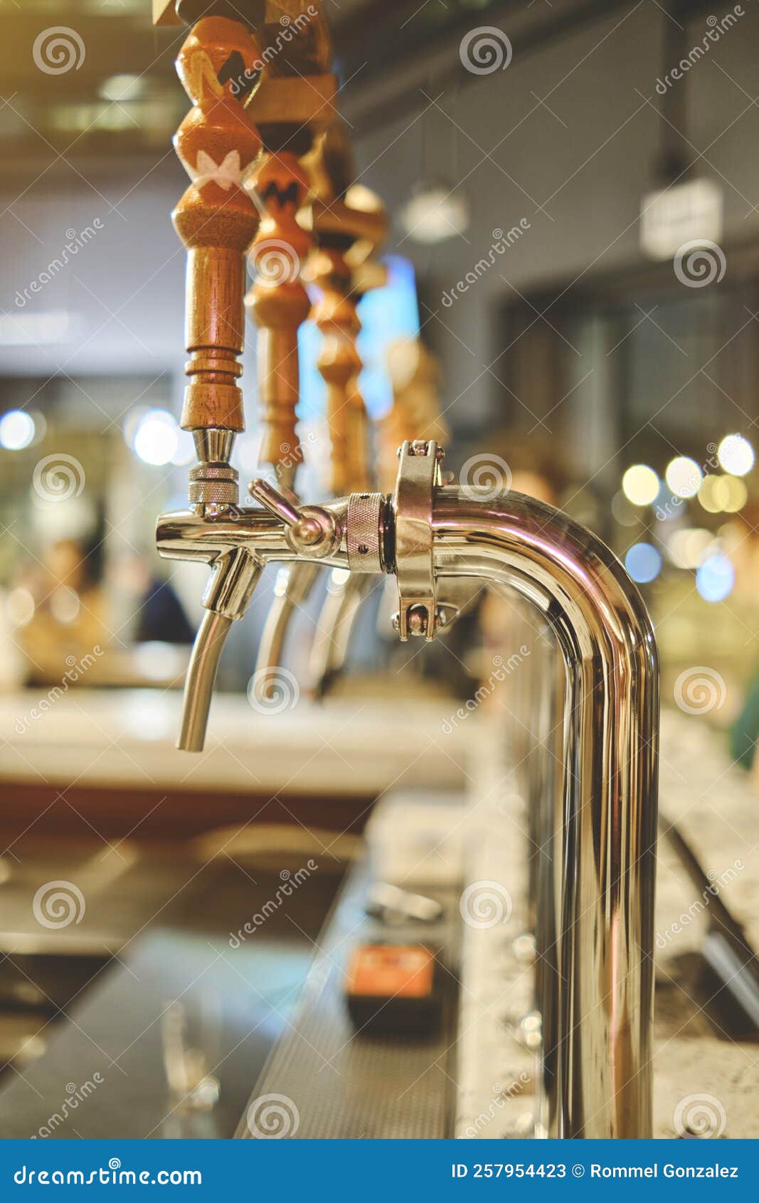 Row of Draft Beer Taps at a Bar. Beer Taps in a Row in Perspective ...