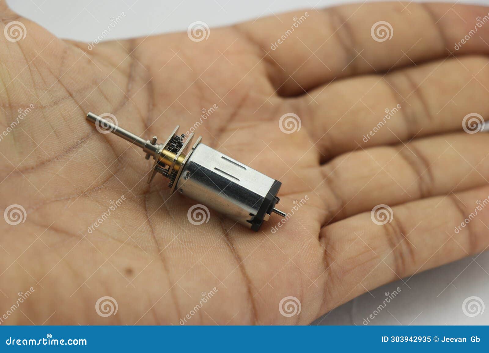 Micro Metal Gear Box Dc Motor Held in the Hand. Mini Dc Motor with ...