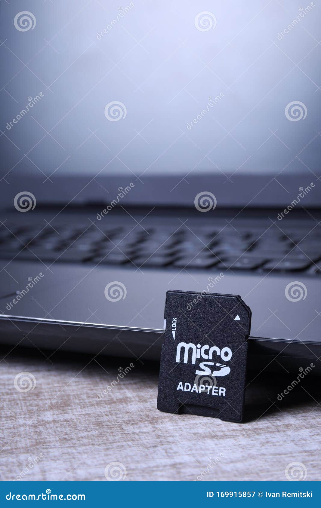 Micro SD Memory Card Adapter on Laptop Background on the Wooden Table ...