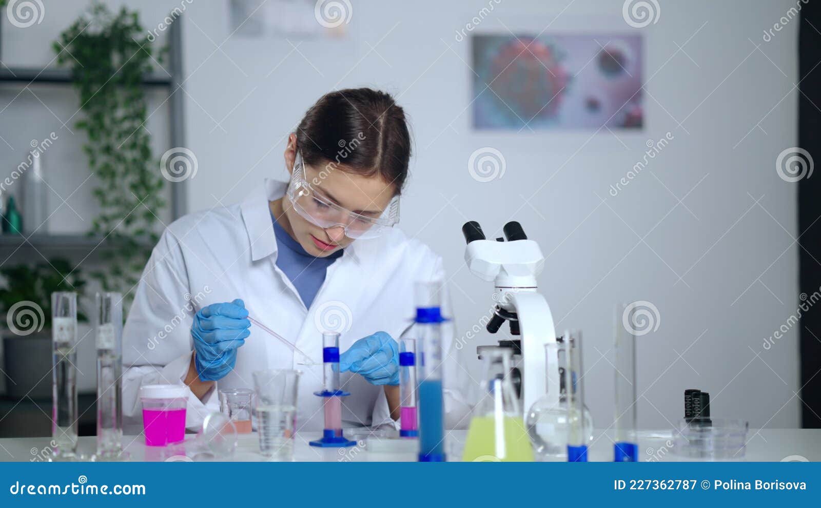 Microbiological Investigation in Laboratory, Woman Employee is Viewing ...