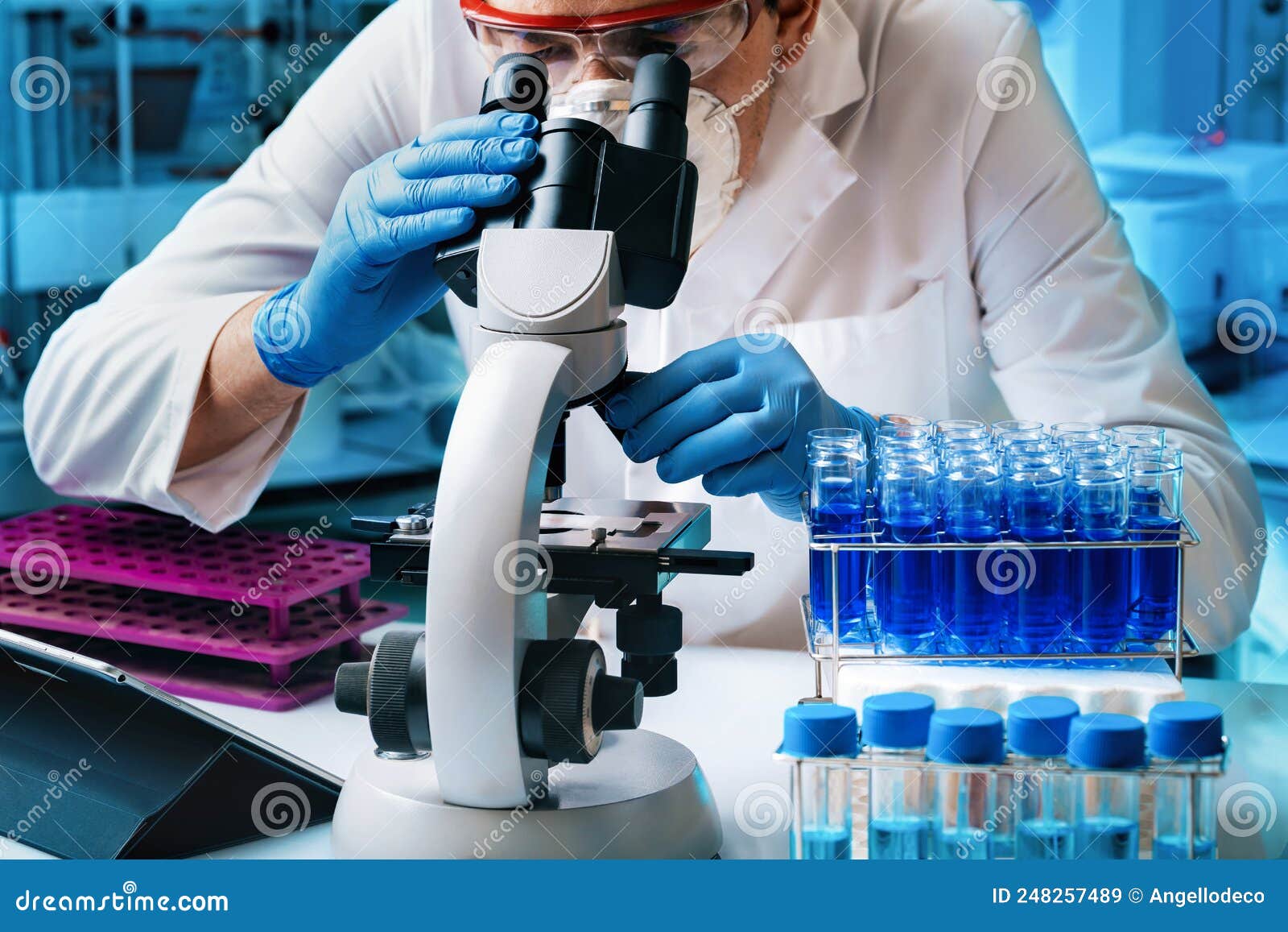 Microbiologist Working with Biological Samples in Microscope of the ...