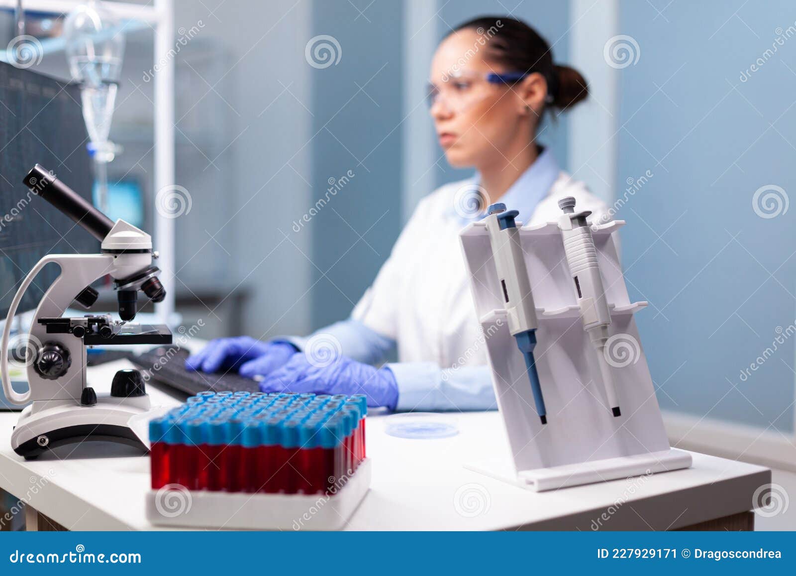 Microbiology Scientist Typing Biochemistry Discovery Experiment At ...