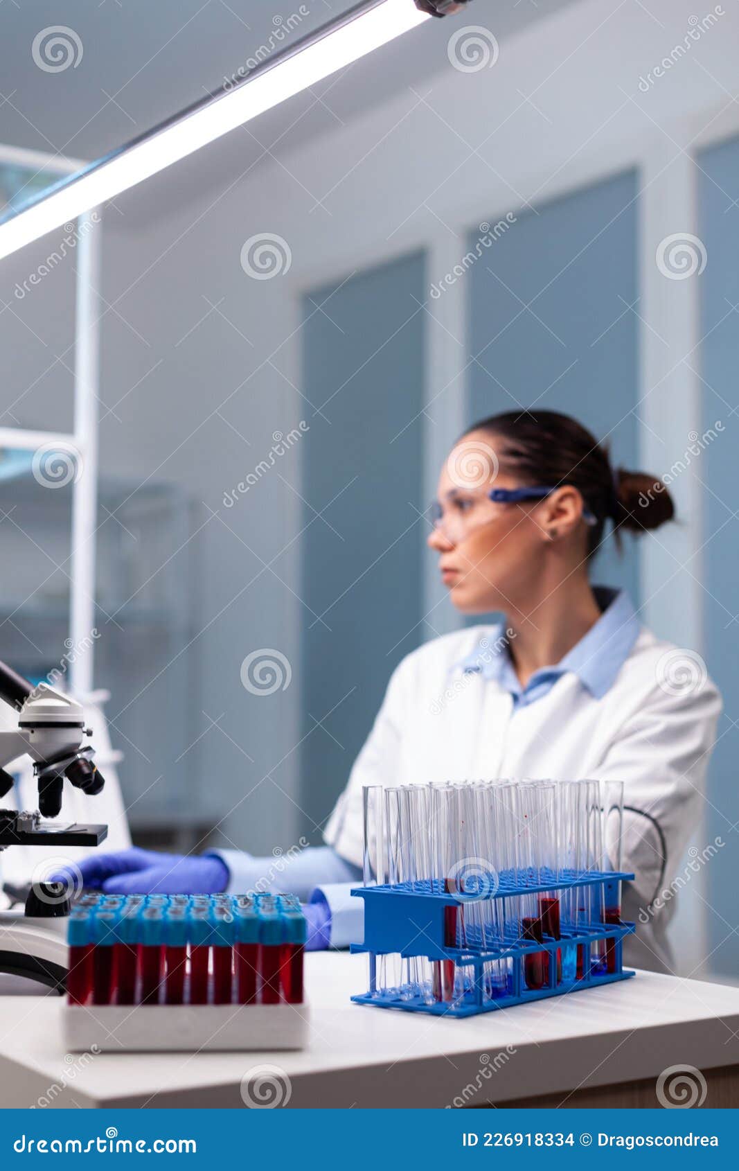 Microbiology Scientist Typing Biochemistry Discovery Experiment At ...