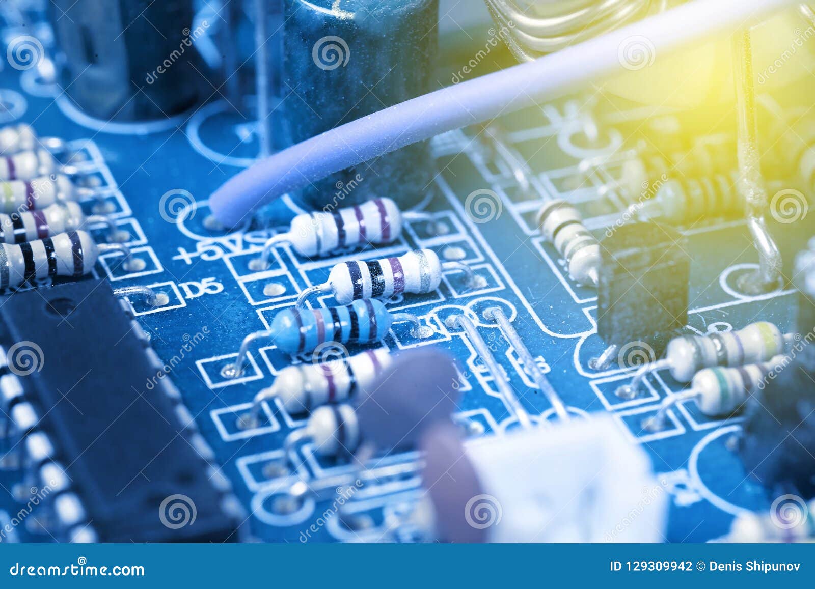 Microchip, Capacitors, Resistors on a Blue Computer Board. Industrial ...