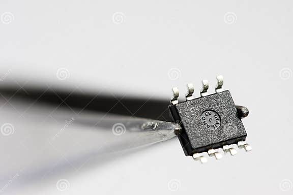 Microchip on a tweezer stock image. Image of surface, board - 5582857