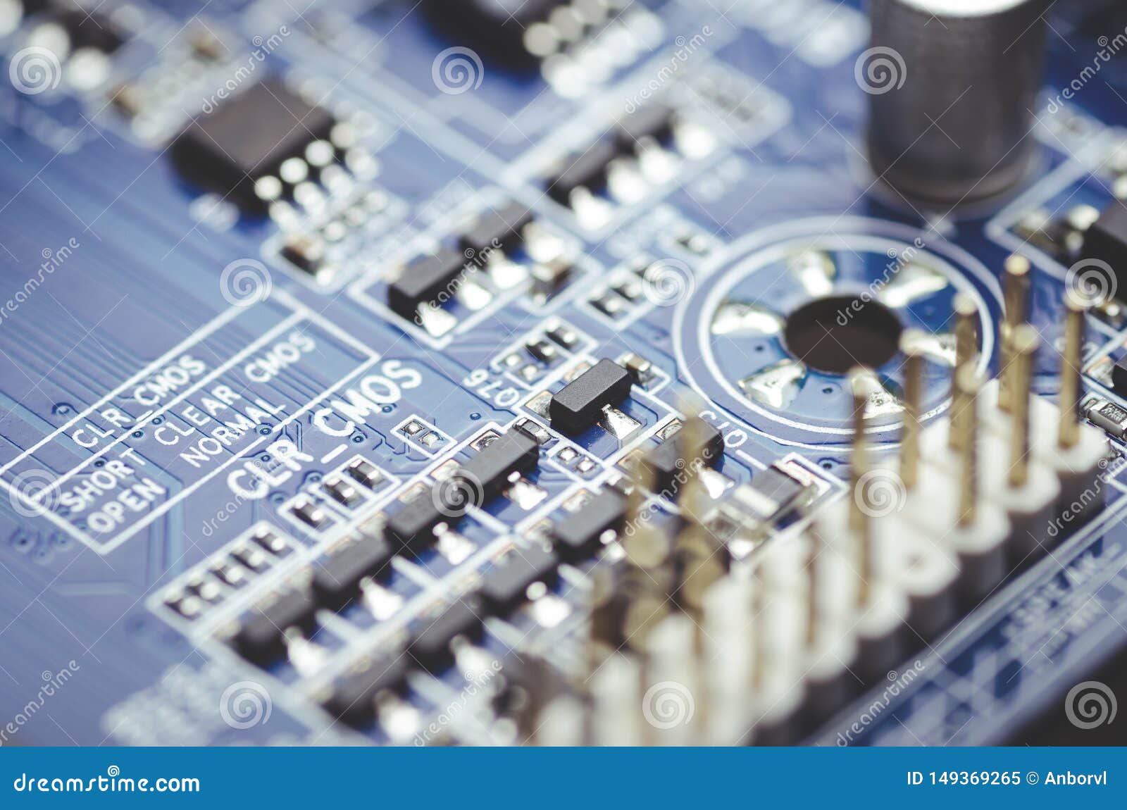 Microchips and Electrical Components on the Blue Motherboard with ...