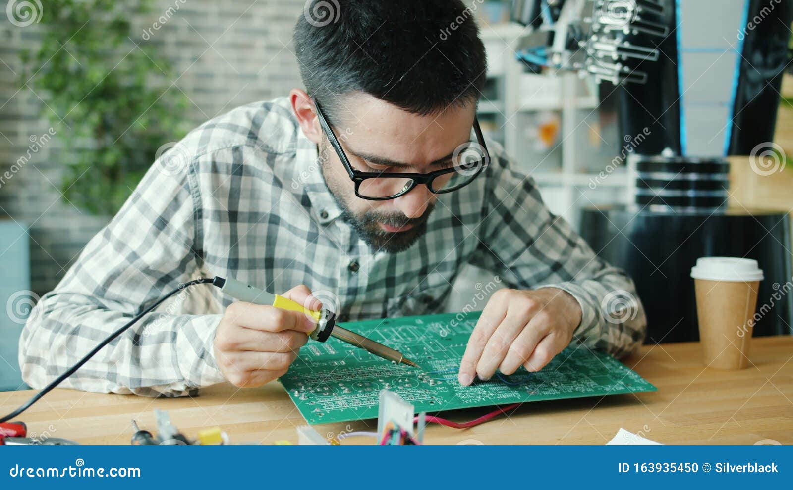 Microelectronics Engineer Repairing Microcircuit for Robot Working in ...