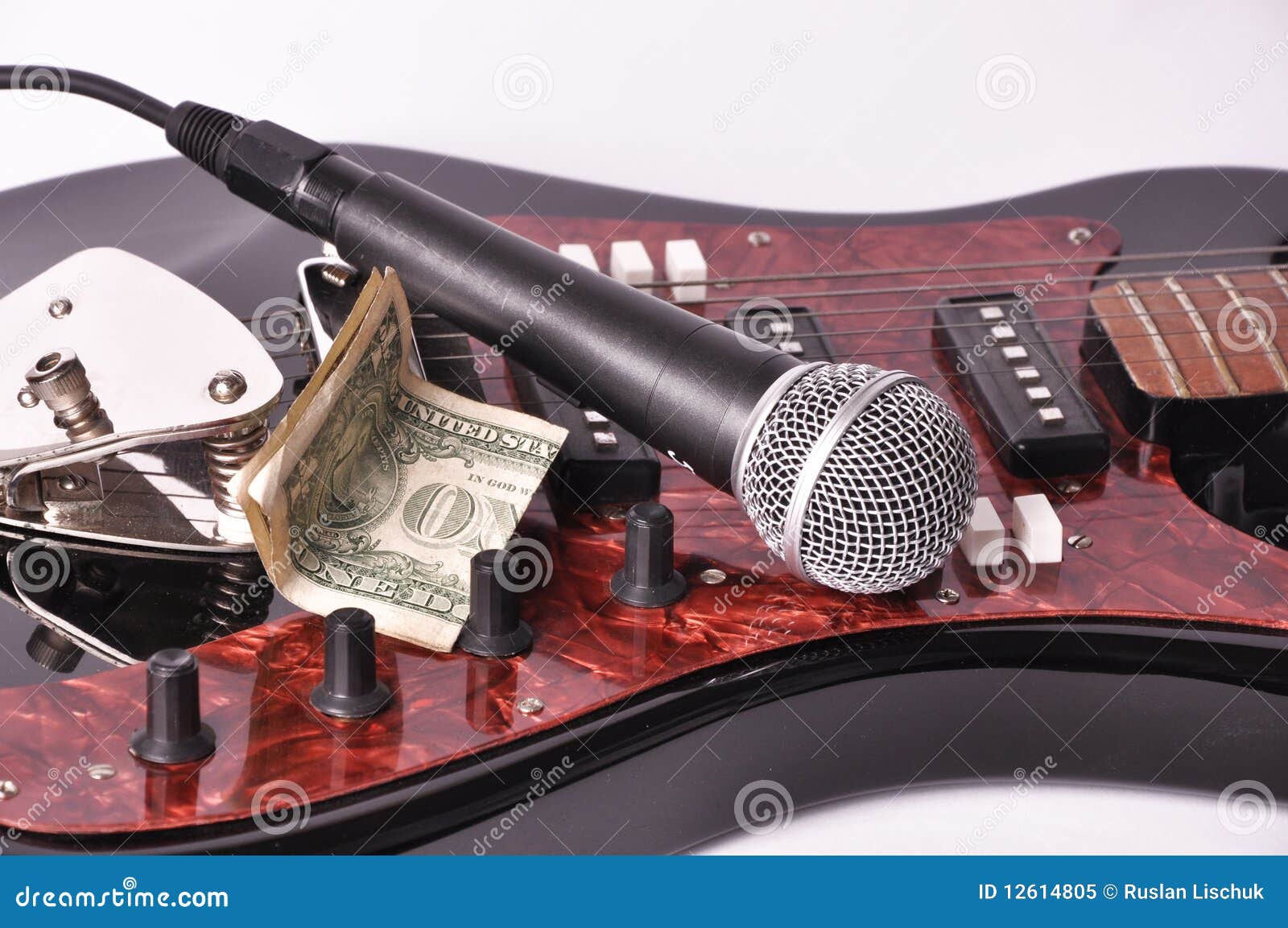 A Microphone and Dollar Lying on a Guitar Stock Image - Image of money ...