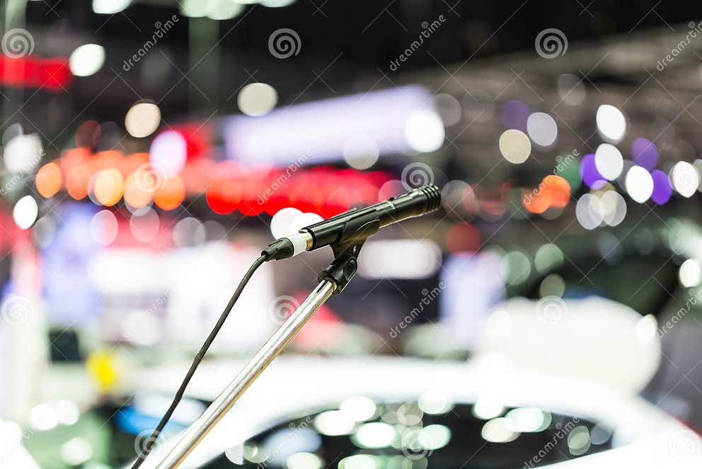 Microphone in Event Hall with Blurry Bokeh Stock Photo - Image of ...