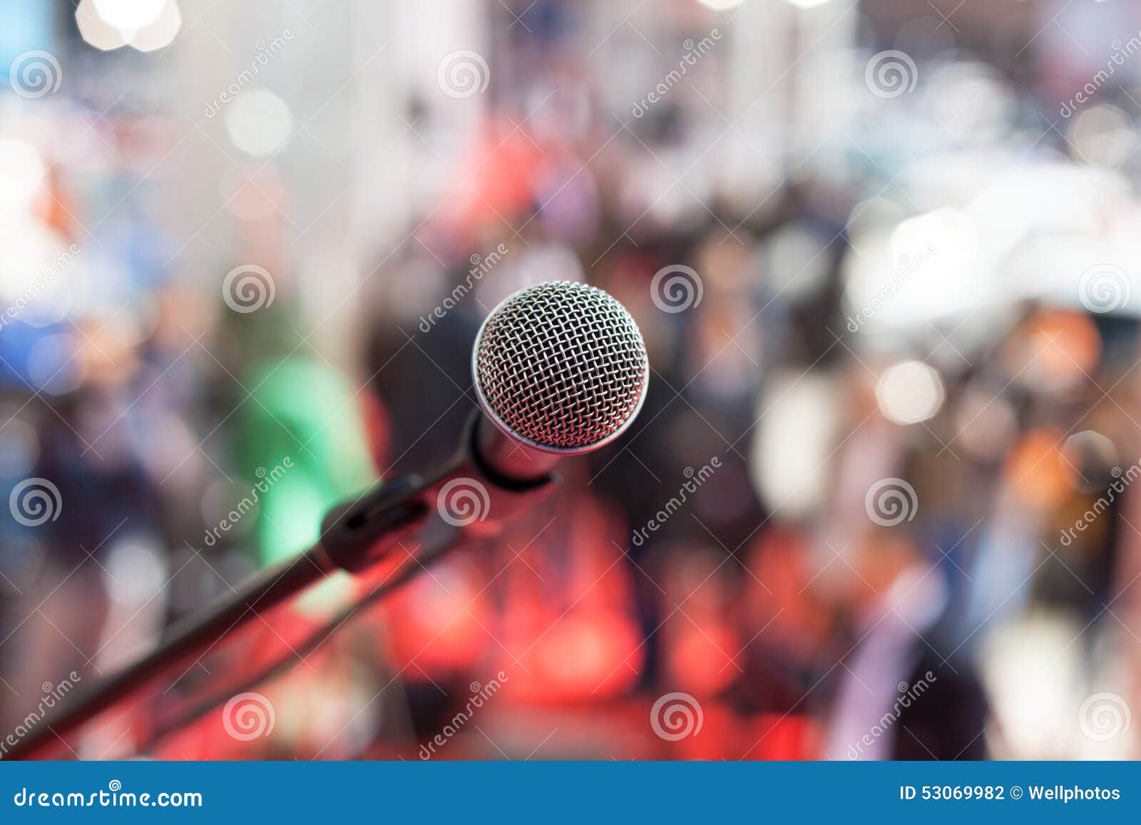 Microphone in Focus Against Blurred Audience Stock Photo - Image of ...