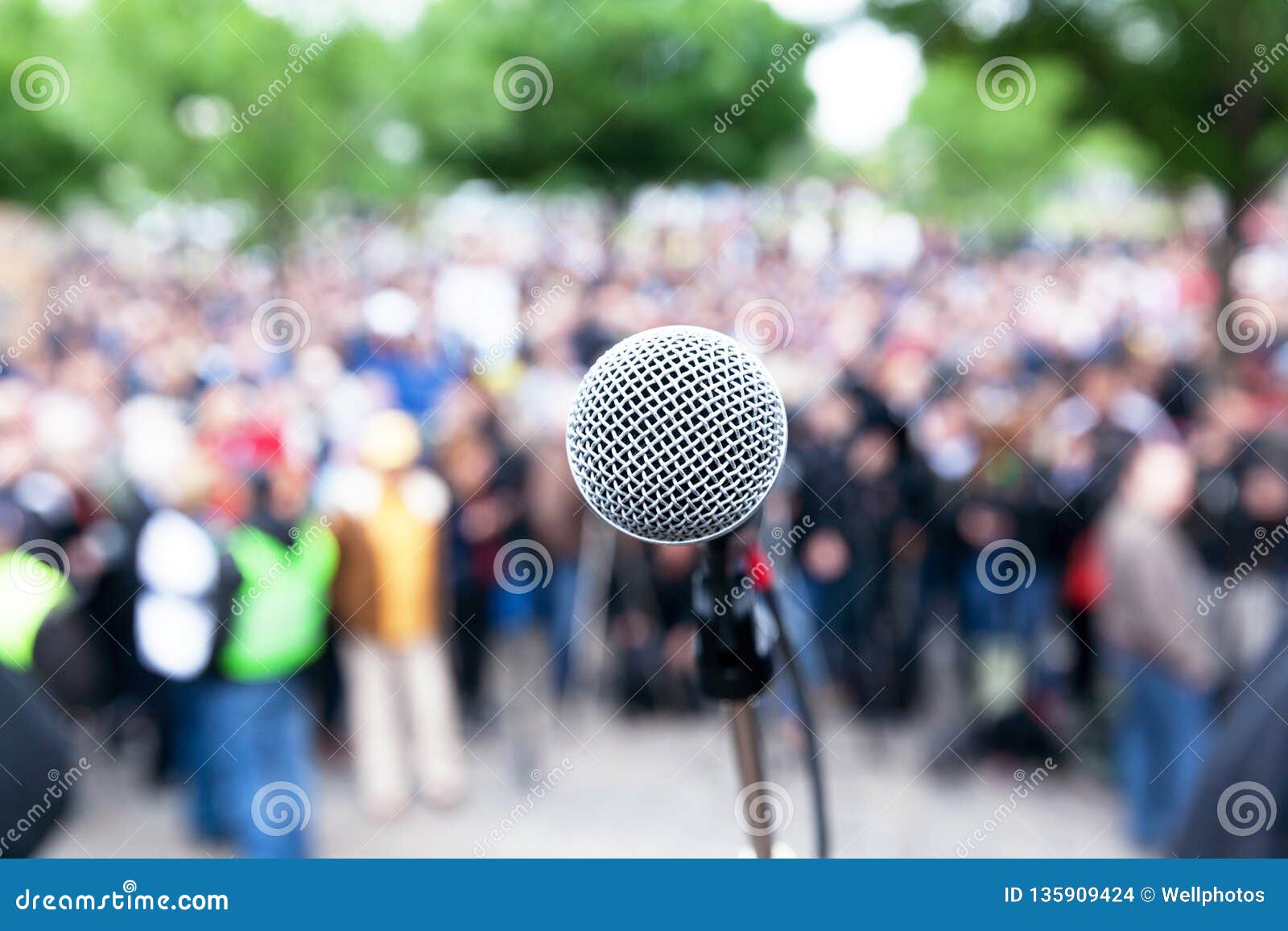 Microphone in Focus Against Blurred Protest or Public Demonstration ...
